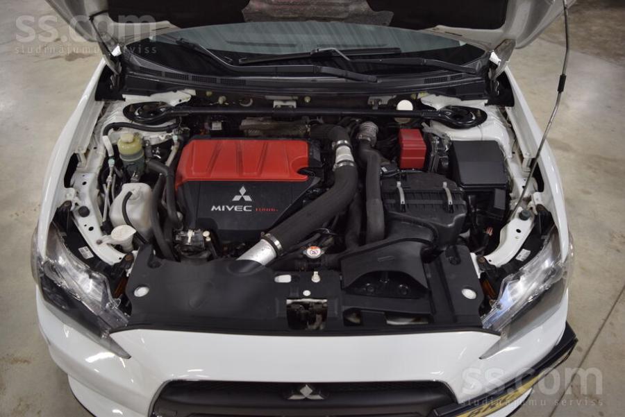 White Mitsubishi Lancer 2014 in Riga, with an engine capacity of 2.00 L and mileage of 117 thousand km for 34900 €, photo 15 on AUTOMOTO.COM.LV