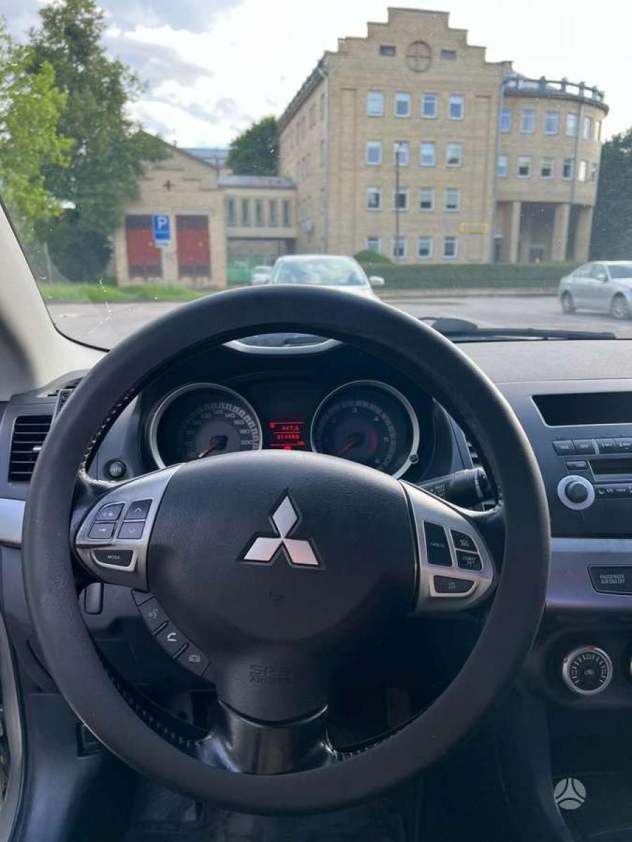 Yellow Mitsubishi Lancer 2008 in Kaunas, with an engine capacity of 1.97 L and mileage of 314 thousand km for 2000 €, photo 6 on AUTOMOTO.COM.LV