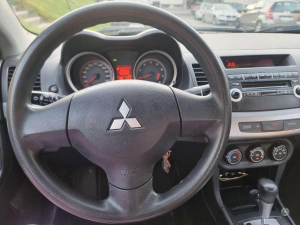 Yellow Mitsubishi Lancer 2008 in Vilnius, with an engine capacity of 1.50 L and mileage of 124 thousand km for 2400 €, photo 5 on AUTOMOTO.COM.LV
