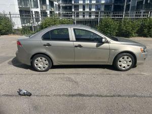 Yellow Mitsubishi Lancer 2009 in Vilnius, with an engine capacity of 1.50 L and mileage of 280 thousand km for 2100 €, photo 3 on AUTOMOTO.COM.LV