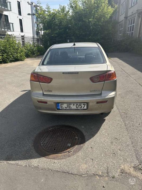 Yellow Mitsubishi Lancer 2009 in Vilnius, with an engine capacity of 1.50 L and mileage of 280 thousand km for 2100 €, photo 3 on AUTOMOTO.COM.LV