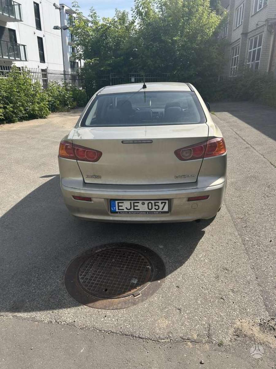 Yellow Mitsubishi Lancer 2009 in Vilnius, with an engine capacity of 1.50 L and mileage of 280 thousand km for 2100 €, photo 4 on AUTOMOTO.COM.LV