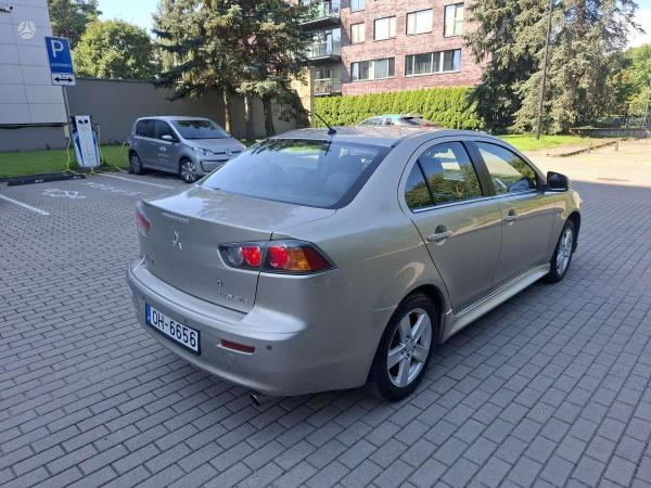 Yellow Mitsubishi Lancer 2011 in Vilnius, with an engine capacity of 1.80 L and mileage of 190 thousand km for 3700 €, photo 5 on AUTOMOTO.COM.LV