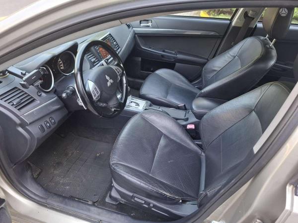 Yellow Mitsubishi Lancer 2011 in Vilnius, with an engine capacity of 1.80 L and mileage of 190 thousand km for 3700 €, photo 9 on AUTOMOTO.COM.LV