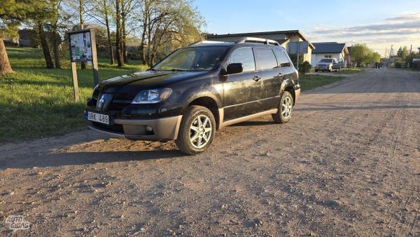 Melns Mitsubishi Outlander 2004 Kauņa, ar dzinēja tilpumu 2.40 L un nobraukumu 210 tūkst. km par 2400 €, foto 1 vietnē AUTOMOTO.COM.LV