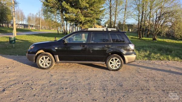 Melns Mitsubishi Outlander 2004 Kauņa, ar dzinēja tilpumu 2.40 L un nobraukumu 210 tūkst. km par 2400 €, foto 2 vietnē AUTOMOTO.COM.LV