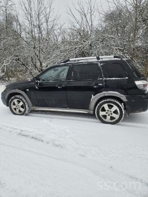 Melns Mitsubishi Outlander 2005 Gulbene, ar dzinēja tilpumu 2.40 L un nobraukumu 304 tūkst. km par 2050 €, foto 7 vietnē AUTOMOTO.COM.LV