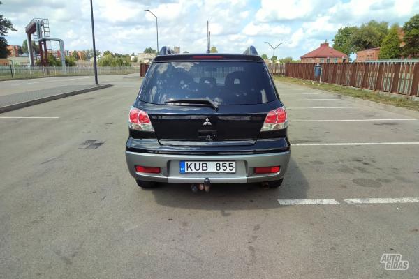 Melns Mitsubishi Outlander 2005 Marijampole, ar dzinēja tilpumu 2.00 L un nobraukumu 291 tūkst. km par 1500 €, foto 9 vietnē AUTOMOTO.COM.LV
