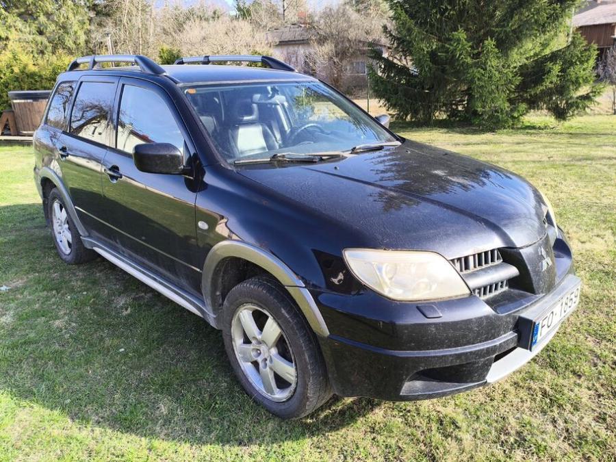 Melns Mitsubishi Outlander 2005 Gulbene, ar dzinēja tilpumu 2.40 L un nobraukumu 305 tūkst. km par 1500 €, foto 1 vietnē AUTOMOTO.COM.LV