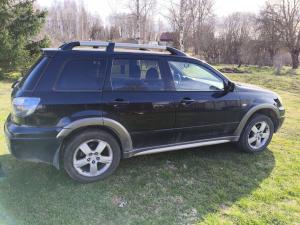 Melns Mitsubishi Outlander 2005 Gulbene, ar dzinēja tilpumu 2.40 L un nobraukumu 305 tūkst. km par 1500 €, foto 3 vietnē AUTOMOTO.COM.LV