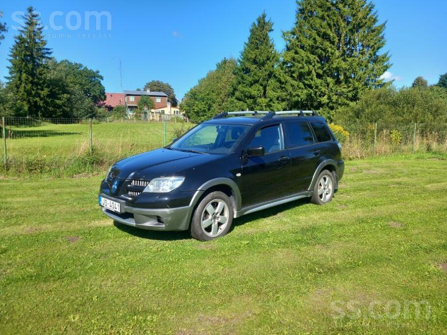 Melns Mitsubishi Outlander 2005 Dobele, ar dzinēja tilpumu 2.40 L un nobraukumu 220 tūkst. km par 800 €, foto 1 vietnē AUTOMOTO.COM.LV