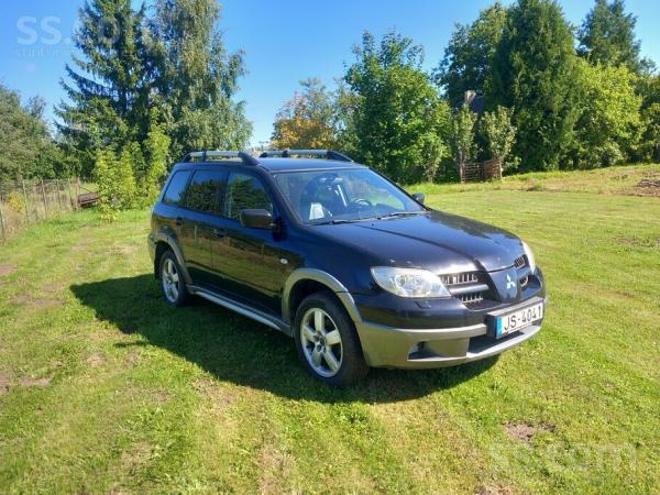 Melns Mitsubishi Outlander 2005 Dobele, ar dzinēja tilpumu 2.40 L un nobraukumu 220 tūkst. km par 800 €, foto 3 vietnē AUTOMOTO.COM.LV