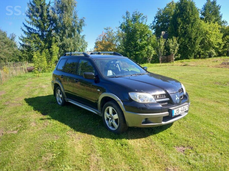Melns Mitsubishi Outlander 2005 Dobele, ar dzinēja tilpumu 2.40 L un nobraukumu 220 tūkst. km par 800 €, foto 3 vietnē AUTOMOTO.COM.LV