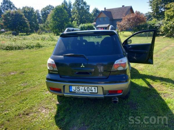 Melns Mitsubishi Outlander 2005 Dobele, ar dzinēja tilpumu 2.40 L un nobraukumu 220 tūkst. km par 800 €, foto 5 vietnē AUTOMOTO.COM.LV
