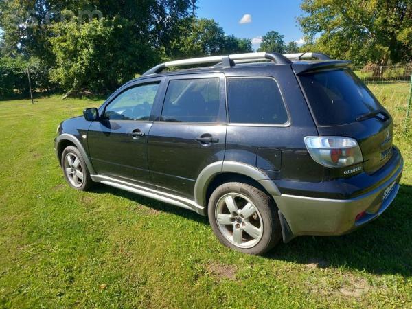 Melns Mitsubishi Outlander 2005 Dobele, ar dzinēja tilpumu 2.40 L un nobraukumu 220 tūkst. km par 800 €, foto 7 vietnē AUTOMOTO.COM.LV
