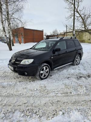 Black Mitsubishi Outlander 2006 in Riga, with an engine capacity of 2.40 L and mileage of 216 thousand km for 2500 €, photo  on AUTOMOTO.COM.LV