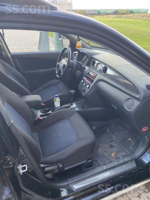 Melns Mitsubishi Outlander 2006 Liepāja, ar dzinēja tilpumu 2.40 L un nobraukumu 279 tūkst. km par 2000 €, foto 13 vietnē AUTOMOTO.COM.LV