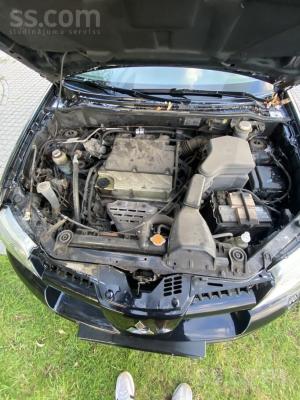 Melns Mitsubishi Outlander 2006 Liepāja, ar dzinēja tilpumu 2.40 L un nobraukumu 279 tūkst. km par 2000 €, foto 18 vietnē AUTOMOTO.COM.LV