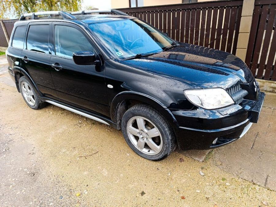 Melns Mitsubishi Outlander 2007 Rīga, ar dzinēja tilpumu 2.40 L un nobraukumu 192 tūkst. km par 2500 €, foto 1 vietnē AUTOMOTO.COM.LV