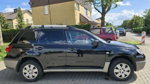 Melns Mitsubishi Outlander 2007 Viļņa, ar dzinēja tilpumu 0.00 L un nobraukumu 100 tūkst. km par 2890 €, foto 4 vietnē AUTOMOTO.COM.LV