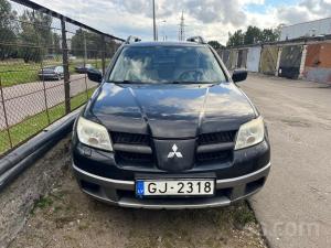 Black Mitsubishi Outlander 2007 in Riga, with an engine capacity of 2.40 L and mileage of 287 thousand km for 1400 €, photo  on AUTOMOTO.COM.LV