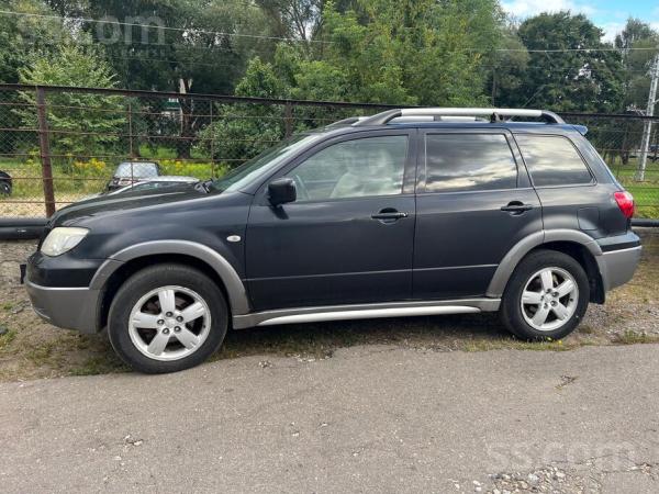 Melns Mitsubishi Outlander 2007 Rīga, ar dzinēja tilpumu 2.40 L un nobraukumu 287 tūkst. km par 1400 €, foto 3 vietnē AUTOMOTO.COM.LV
