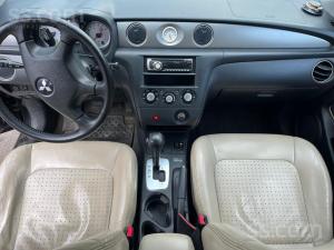 Black Mitsubishi Outlander 2007 in Riga, with an engine capacity of 2.40 L and mileage of 287 thousand km for 1400 €, photo 9 on AUTOMOTO.COM.LV