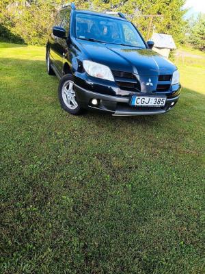Black Mitsubishi Outlander 2007 in Kretinga, with an engine capacity of 2.38 L and mileage of 222 thousand km for 2000 €, photo 3 on AUTOMOTO.COM.LV