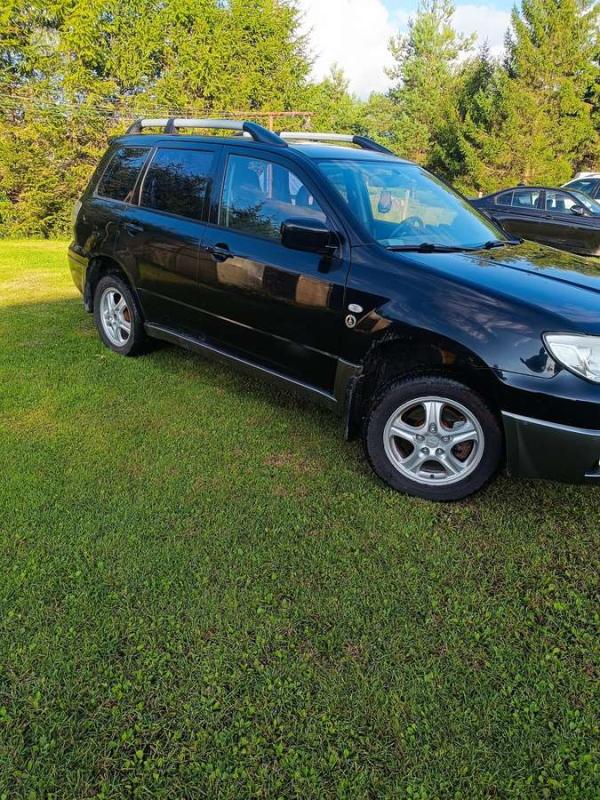 Black Mitsubishi Outlander 2007 in Kretinga, with an engine capacity of 2.38 L and mileage of 222 thousand km for 2000 €, photo 5 on AUTOMOTO.COM.LV
