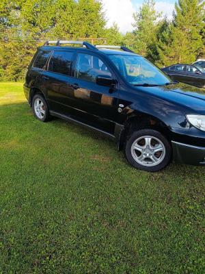 Black Mitsubishi Outlander 2007 in Kretinga, with an engine capacity of 2.38 L and mileage of 222 thousand km for 2000 €, photo 6 on AUTOMOTO.COM.LV
