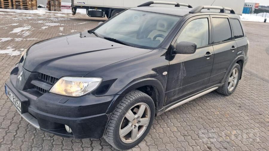 Melns Mitsubishi Outlander 2007 Rīga, ar dzinēja tilpumu 2.40 L un nobraukumu 262 tūkst. km par 1000 €, foto 1 vietnē AUTOMOTO.COM.LV