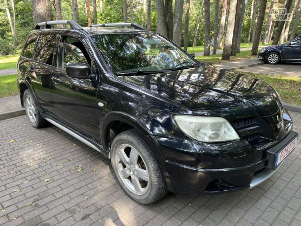 Black Mitsubishi Outlander 2008 in Palanga, with an engine capacity of 2.40 L and mileage of 226 thousand km for 1750 €, photo 3 on AUTOMOTO.COM.LV