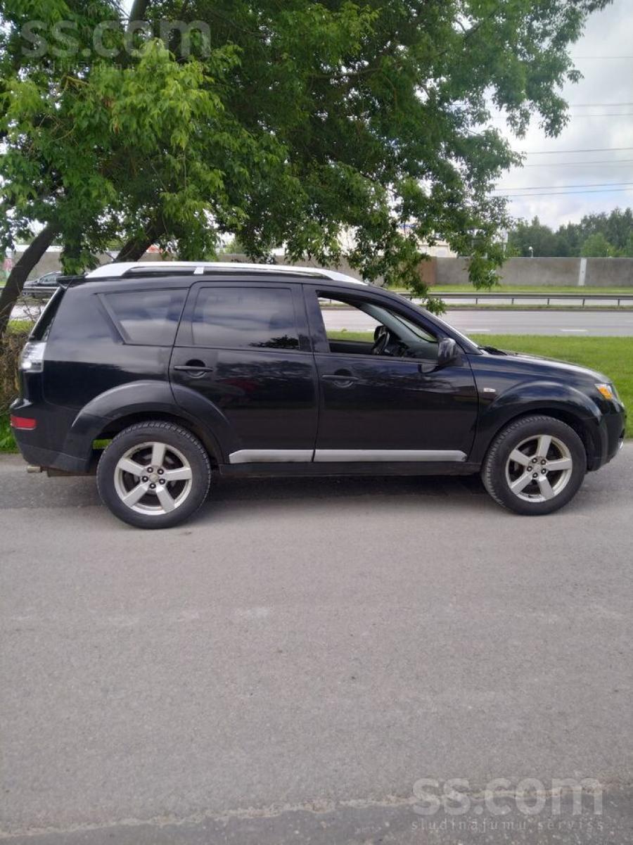 Melns Mitsubishi Outlander 2008 Rīga, ar dzinēja tilpumu 2.00 L un nobraukumu 310 tūkst. km par 2700 €, foto 10 vietnē AUTOMOTO.COM.LV
