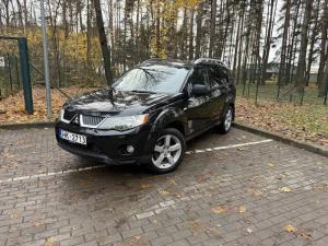 Black Mitsubishi Outlander 2009 in Riga, with an engine capacity of 2.00 L and mileage of 244 thousand km for 2490 €, photo  on AUTOMOTO.COM.LV