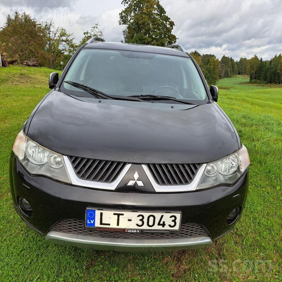 Melns Mitsubishi Outlander 2009 Alūksne, ar dzinēja tilpumu 2.20 L un nobraukumu 326 tūkst. km par 5500 €, foto 5 vietnē AUTOMOTO.COM.LV