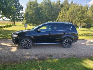 Melns Mitsubishi Outlander 2010 Panevēža, ar dzinēja tilpumu 2.18 L un nobraukumu 331 tūkst. km par 4200 €, foto 4 vietnē AUTOMOTO.COM.LV