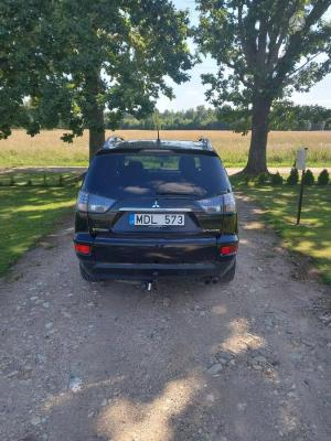 Melns Mitsubishi Outlander 2010 Panevēža, ar dzinēja tilpumu 2.18 L un nobraukumu 331 tūkst. km par 4200 €, foto 5 vietnē AUTOMOTO.COM.LV