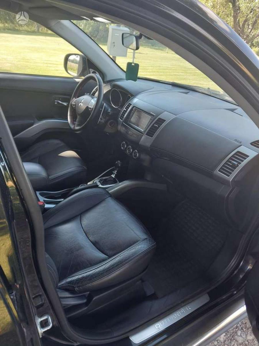 Melns Mitsubishi Outlander 2010 Panevēža, ar dzinēja tilpumu 2.18 L un nobraukumu 331 tūkst. km par 4200 €, foto 8 vietnē AUTOMOTO.COM.LV