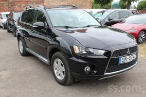 Melns Mitsubishi Outlander 2011 Liepāja, ar dzinēja tilpumu 2.30 L un nobraukumu 327 tūkst. km par 4650 €, foto  vietnē AUTOMOTO.COM.LV