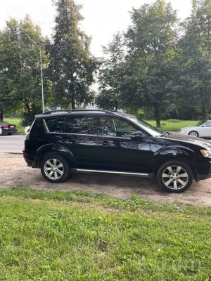 Black Mitsubishi Outlander 2011 in Riga, with an engine capacity of 2.20 L and mileage of 292 thousand km for 4000 €, photo  on AUTOMOTO.COM.LV