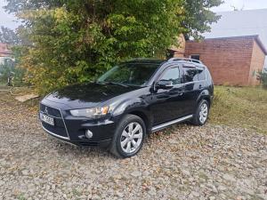 Black Mitsubishi Outlander 2012 in Riga, with an engine capacity of 2.20 L and mileage of 0 thousand km for 4550 €, photo 3 on AUTOMOTO.COM.LV