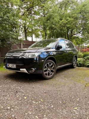 Melns Mitsubishi Outlander 2014 Rīga, ar dzinēja tilpumu 2.30 L un nobraukumu 132 tūkst. km par 8700 €, foto  vietnē AUTOMOTO.COM.LV