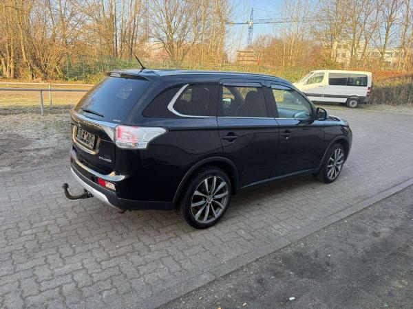 Melns Mitsubishi Outlander 2015 Jurbarkas, ar dzinēja tilpumu 2.27 L un nobraukumu 186 tūkst. km par 8300 €, foto 4 vietnē AUTOMOTO.COM.LV