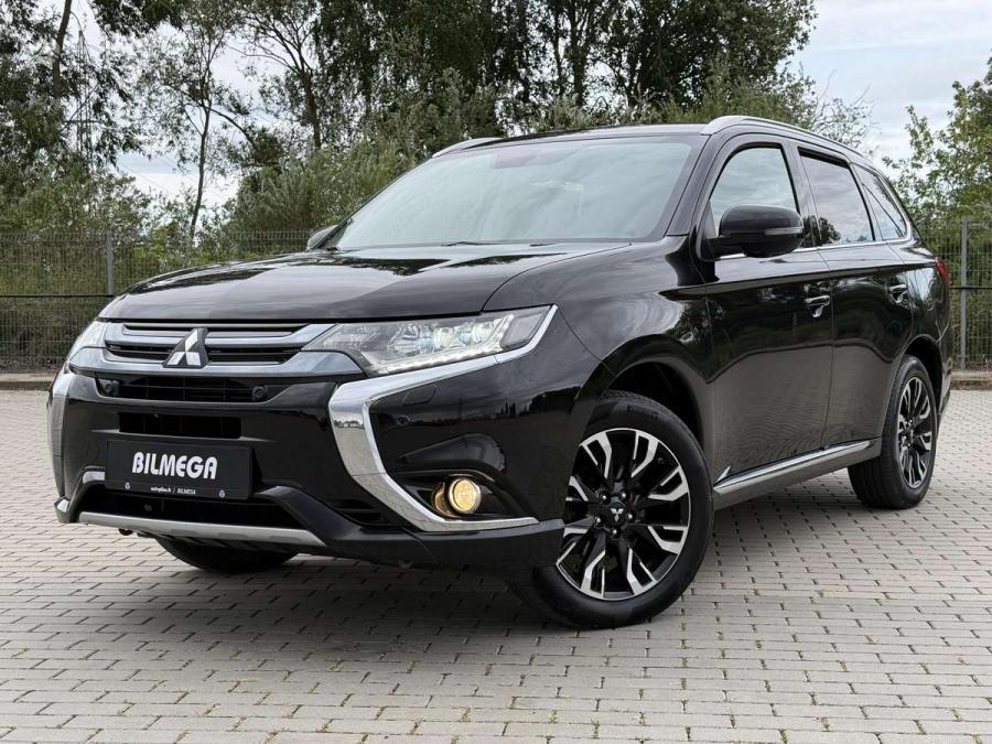 Black Mitsubishi Outlander 2015 in Marijampole, with an engine capacity of 2.00 L and mileage of 233 thousand km for 9800 €, photo 1 on AUTOMOTO.COM.LV