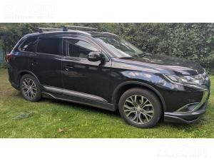 Melns Mitsubishi Outlander 2016 Rīga, ar dzinēja tilpumu 2.30 L un nobraukumu 119 tūkst. km par 13500 €, foto  vietnē AUTOMOTO.COM.LV