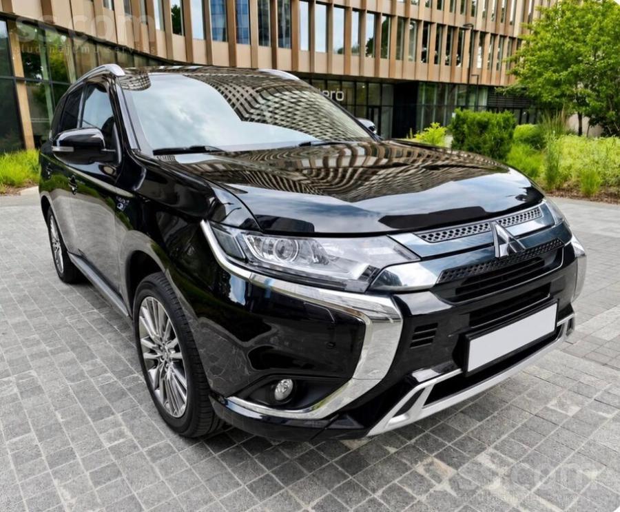 Black Mitsubishi Outlander 2021 in Ventspils, with an engine capacity of 2.40 L and mileage of 83 thousand km for 22650 €, photo 1 on AUTOMOTO.COM.LV
