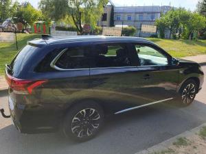 Black Mitsubishi Outlander 2015 in Vilnius, with an engine capacity of 2.00 L and mileage of 178 thousand km for 13550 €, photo 5 on AUTOMOTO.COM.LV