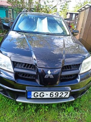 Black Mitsubishi Outlander 2006 in Riga, with an engine capacity of 2.30 L and mileage of 167 thousand km for 1900 €, photo  on AUTOMOTO.COM.LV