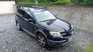 Black Mitsubishi Outlander 2007 in Tallinn, with an engine capacity of 0.00 L and mileage of 179 thousand km for 1350 €, photo 7 on AUTOMOTO.COM.LV