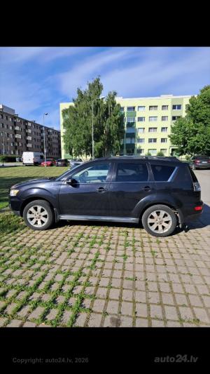 Black Mitsubishi Outlander 2011 in Tallinn, with an engine capacity of 2.40 L and mileage of 129 thousand km for 7290 €, photo  on AUTOMOTO.COM.LV